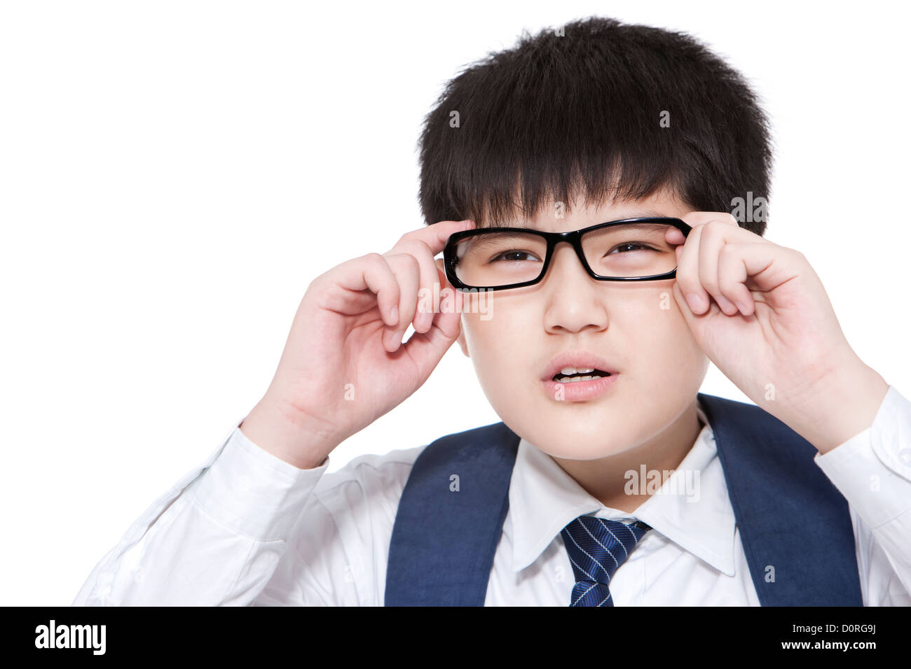 Nearsighted schoolboy having trouble seeing things clearly adjusting ...