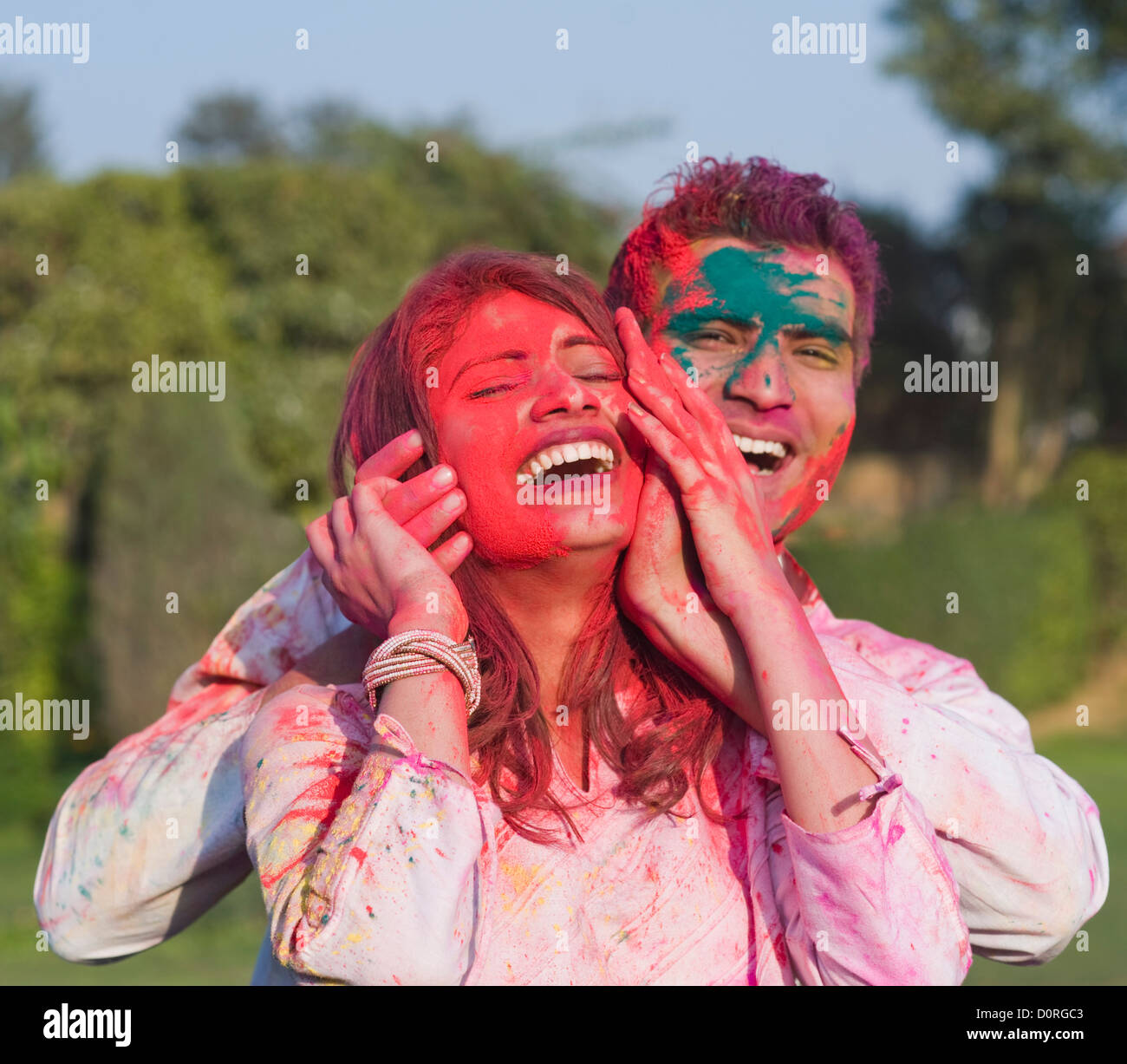 Couple celebrating Holi Stock Photo - Alamy