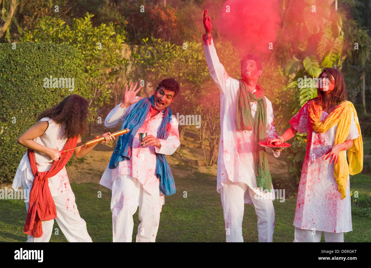Friends celebrating Holi Stock Photo - Alamy