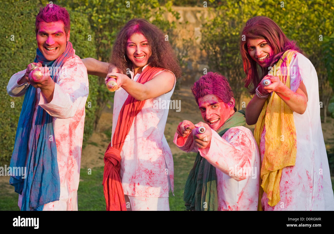 Friends celebrating Holi Stock Photo - Alamy