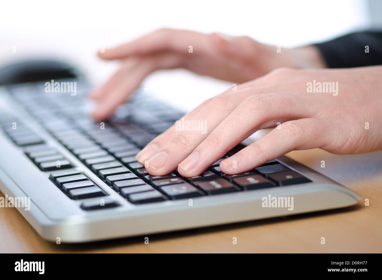 Hands typing on the keyboard Stock Photo - Alamy