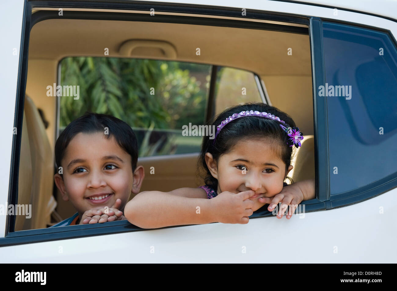 Children smiling in a car Stock Photo - Alamy