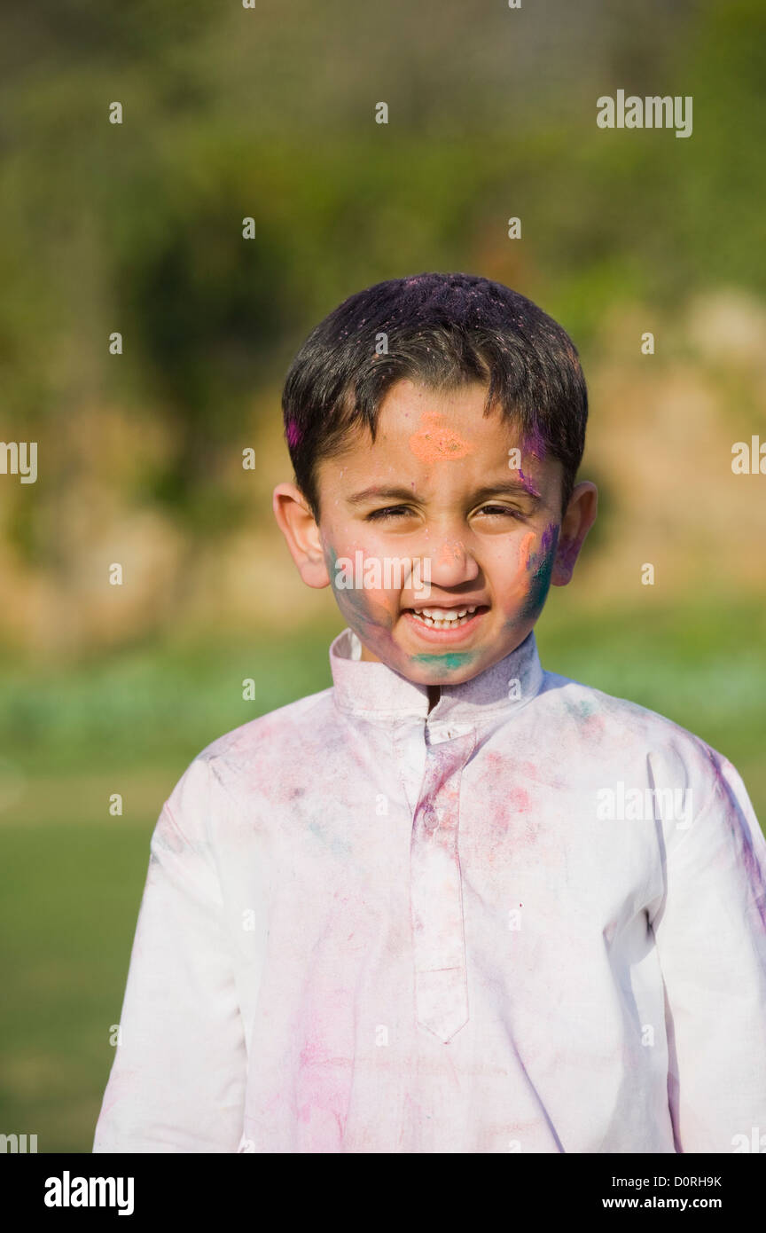 Boy with holi paint on his face hi-res stock photography and images - Alamy