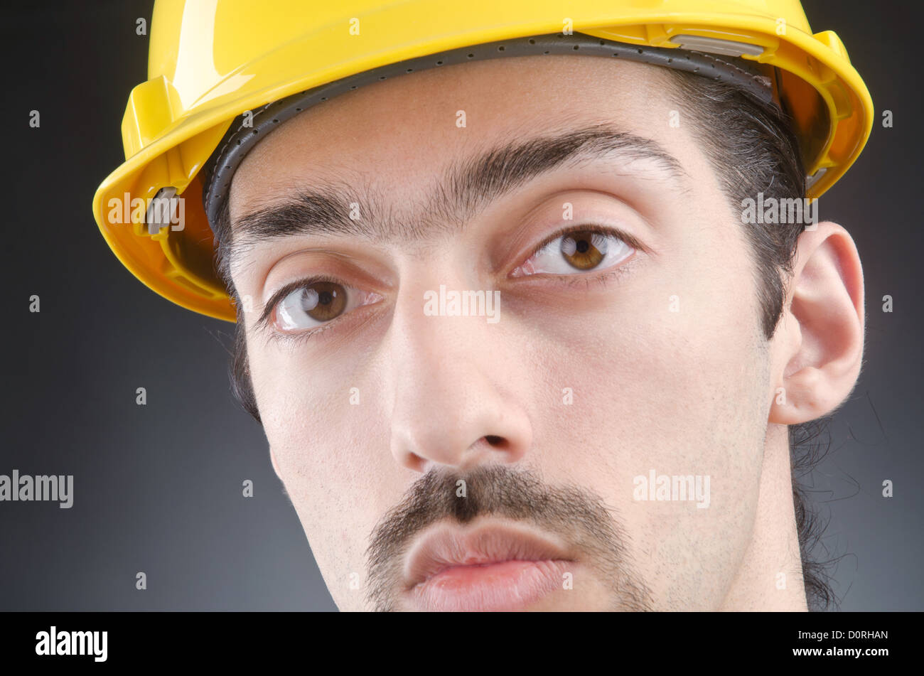 Construction worker in studio shooting Stock Photo - Alamy