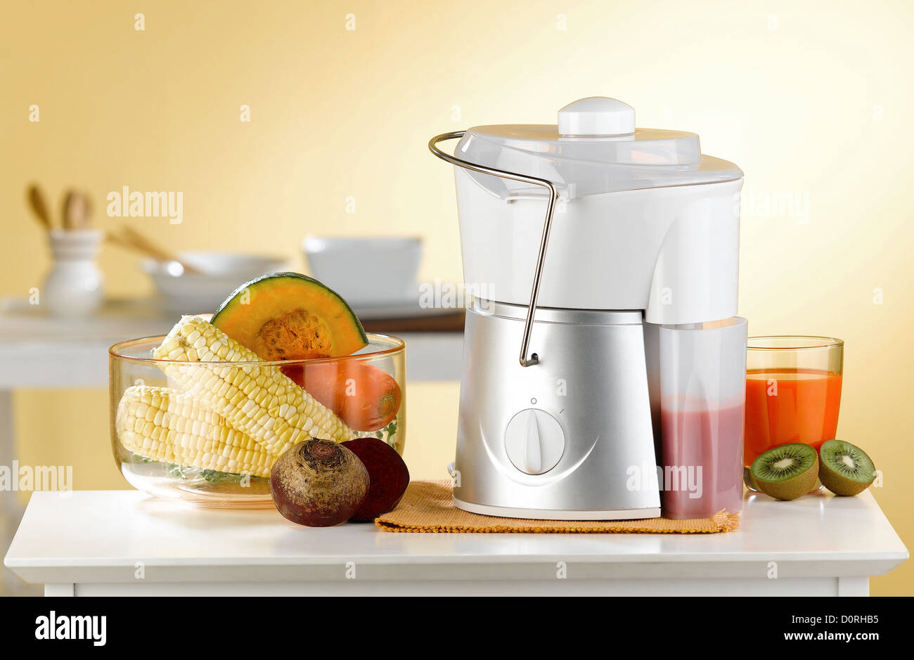 Makes variety fruits juice by maker blender machine in the kitchen ...