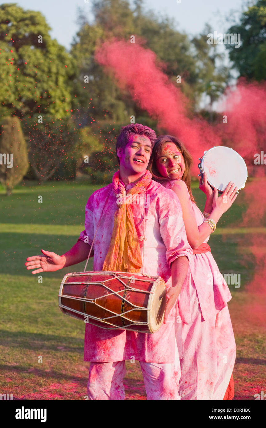 Cheerful Couple Playing Musical Instruments High Resolution Stock ...
