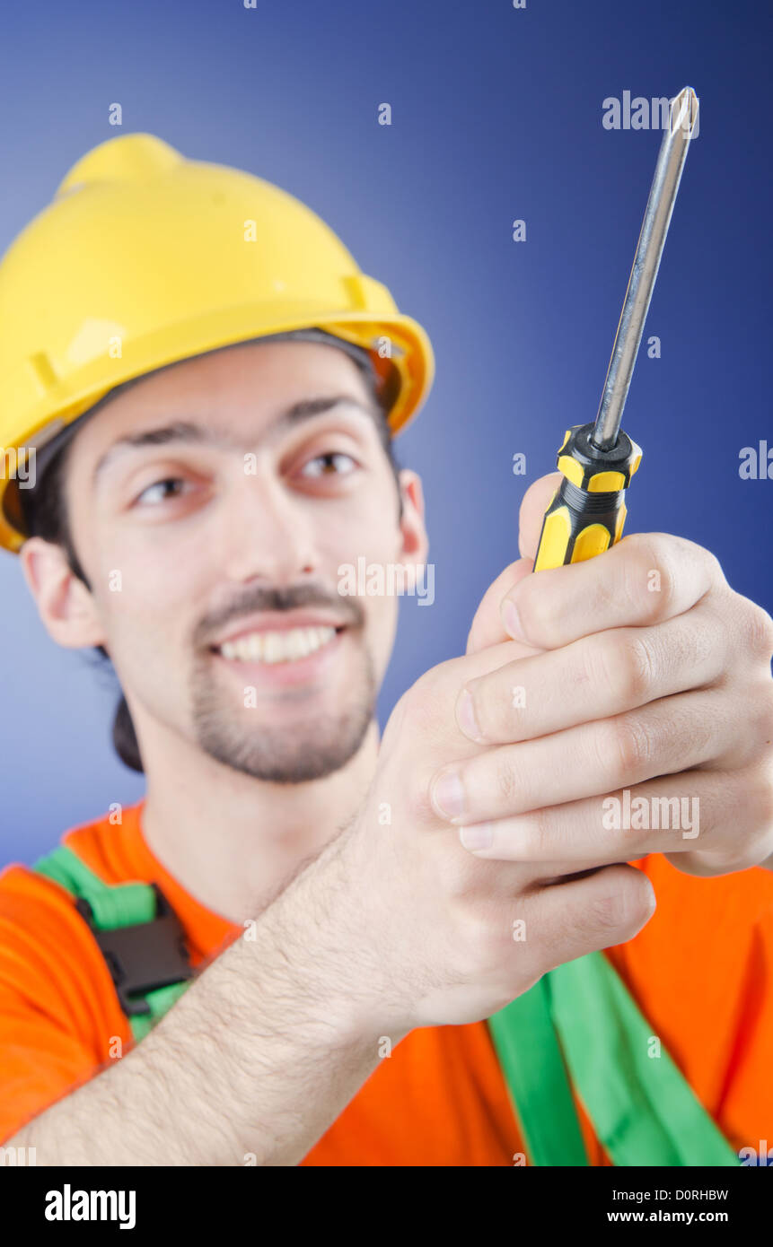 Man with a screwdriver in studio Stock Photo - Alamy