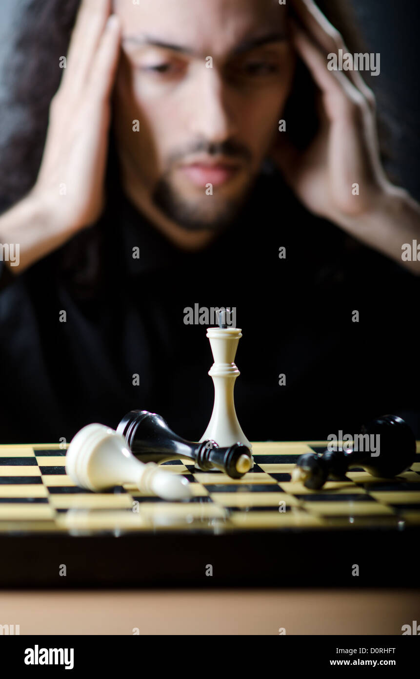 Chess player playing his game Stock Photo - Alamy