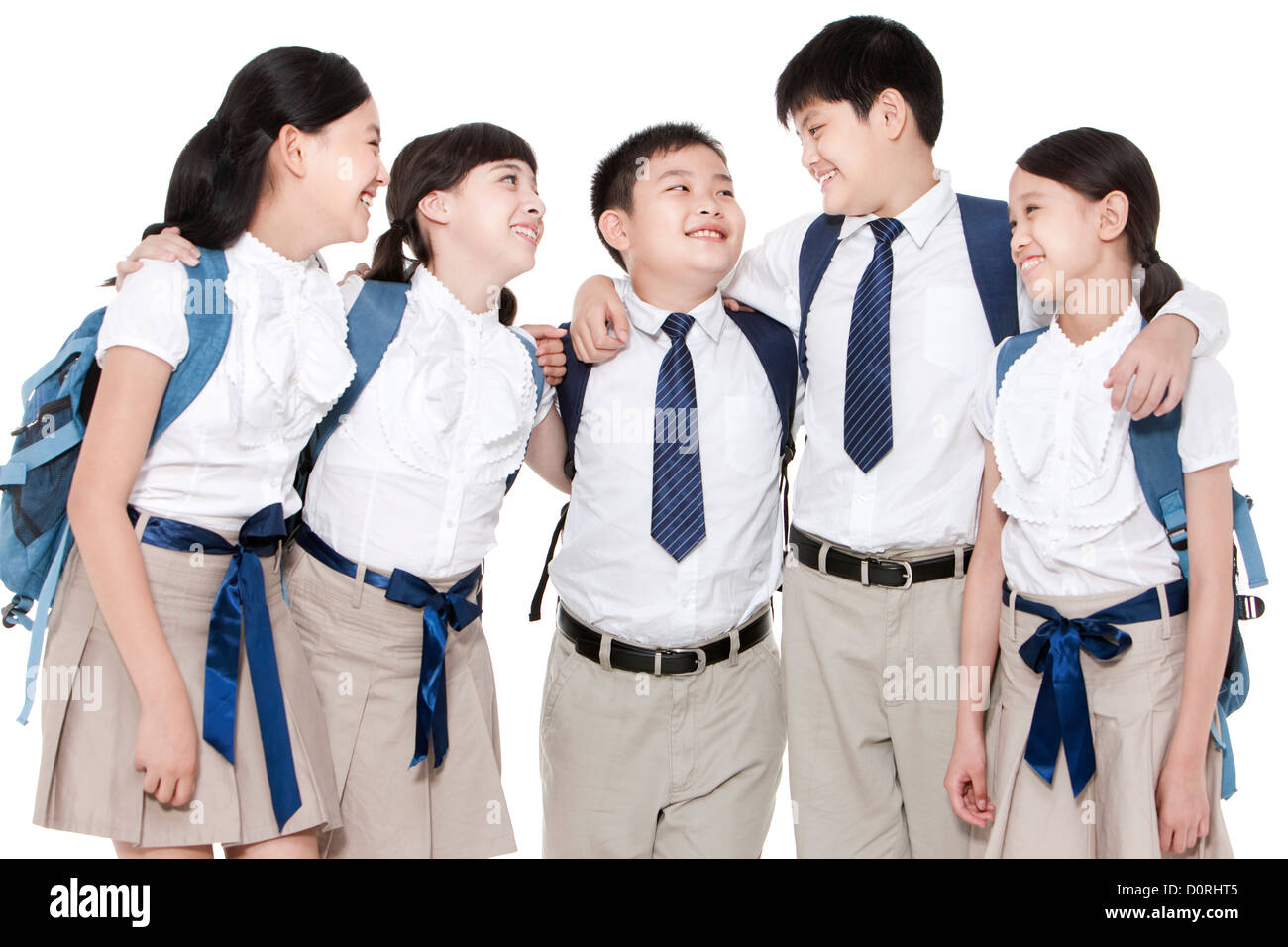 Cheerful primary school friends enjoying being around each other Stock ...