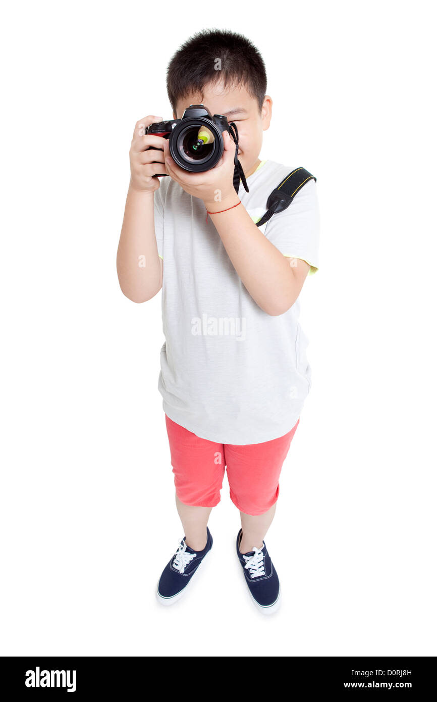 Cute boy photographing with SLR camera Stock Photo - Alamy