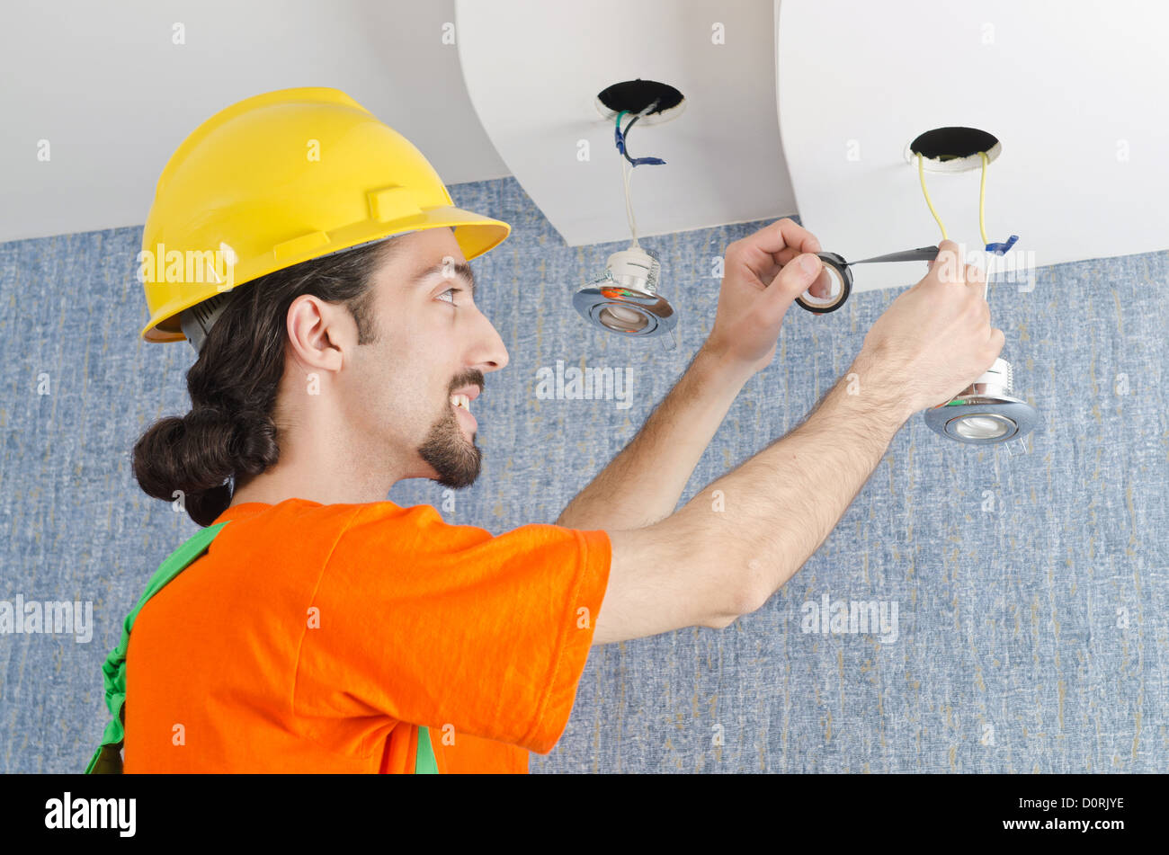 Electrician repairman working on refurbishment Stock Photo - Alamy