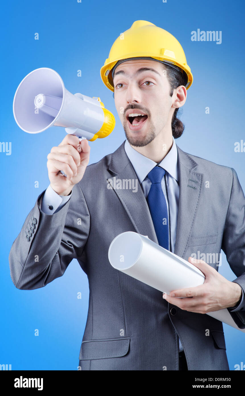Construction worker shouting via loudspeaker Stock Photo - Alamy