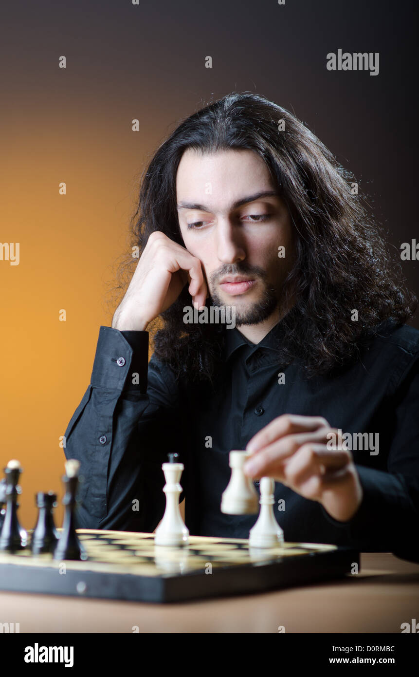Chess player playing his game Stock Photo - Alamy