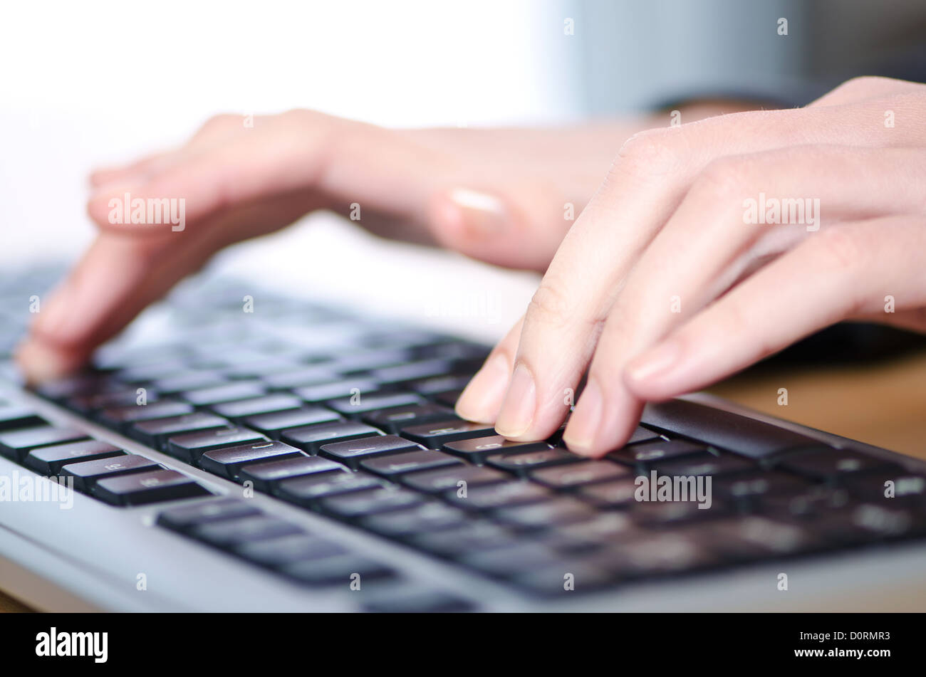 Hands typing on the keyboard Stock Photo - Alamy