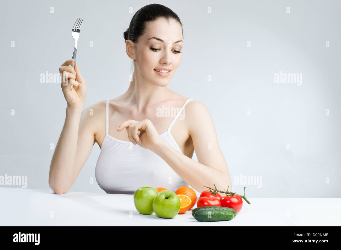 A beautiful slender girl eating healthy food Stock Photo - Alamy
