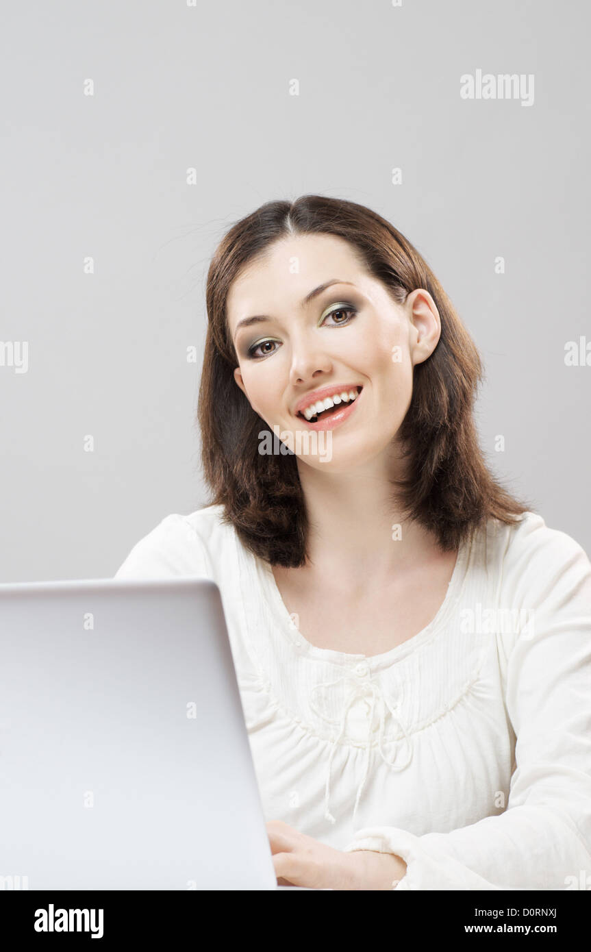 A beautiful girl working in a laptop Stock Photo - Alamy