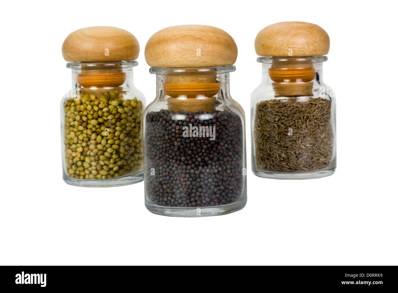 Three containers of assorted spices Stock Photo - Alamy