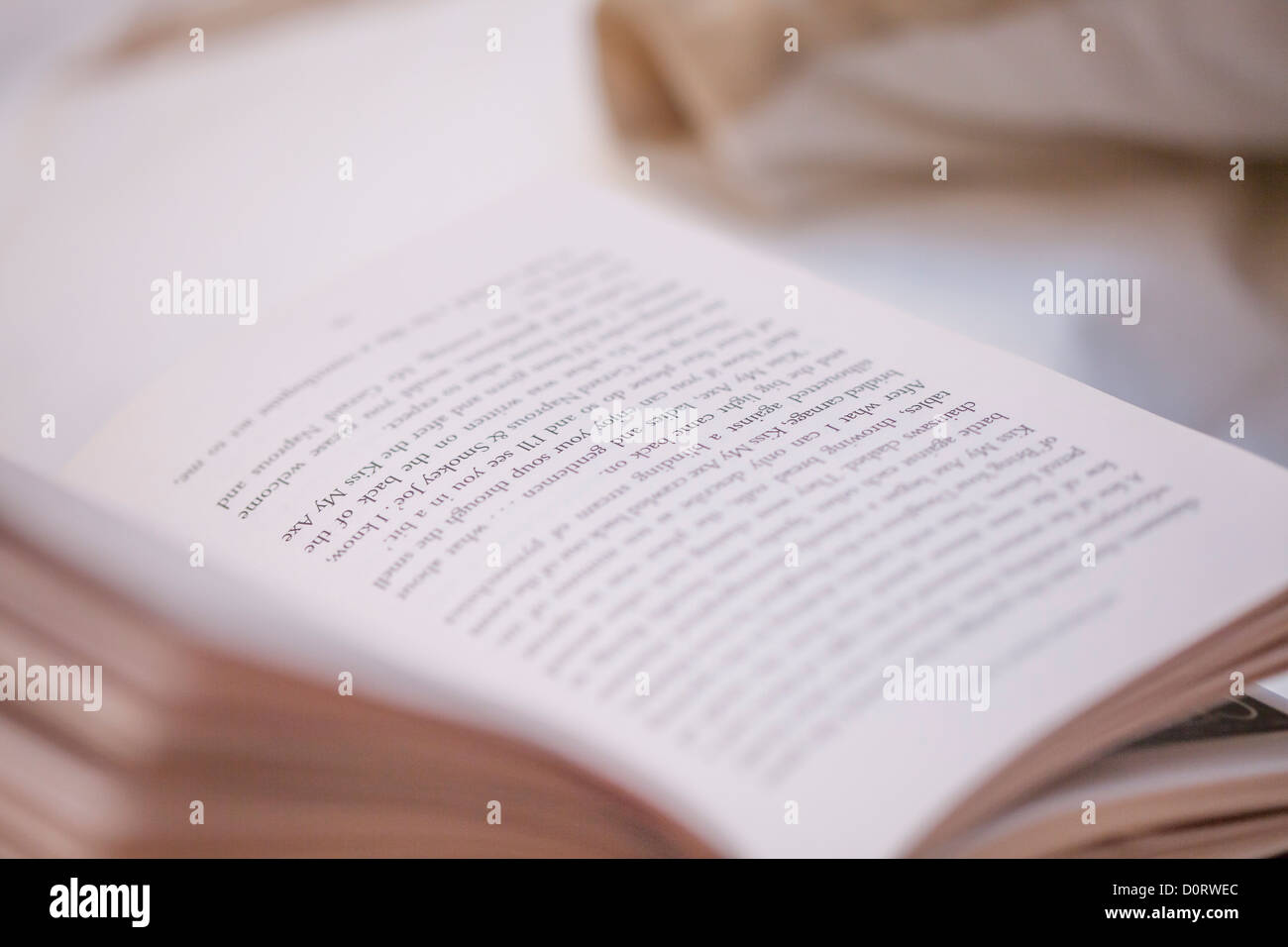 Night time reading, reading in bed. Paperback book with reading glasses ...