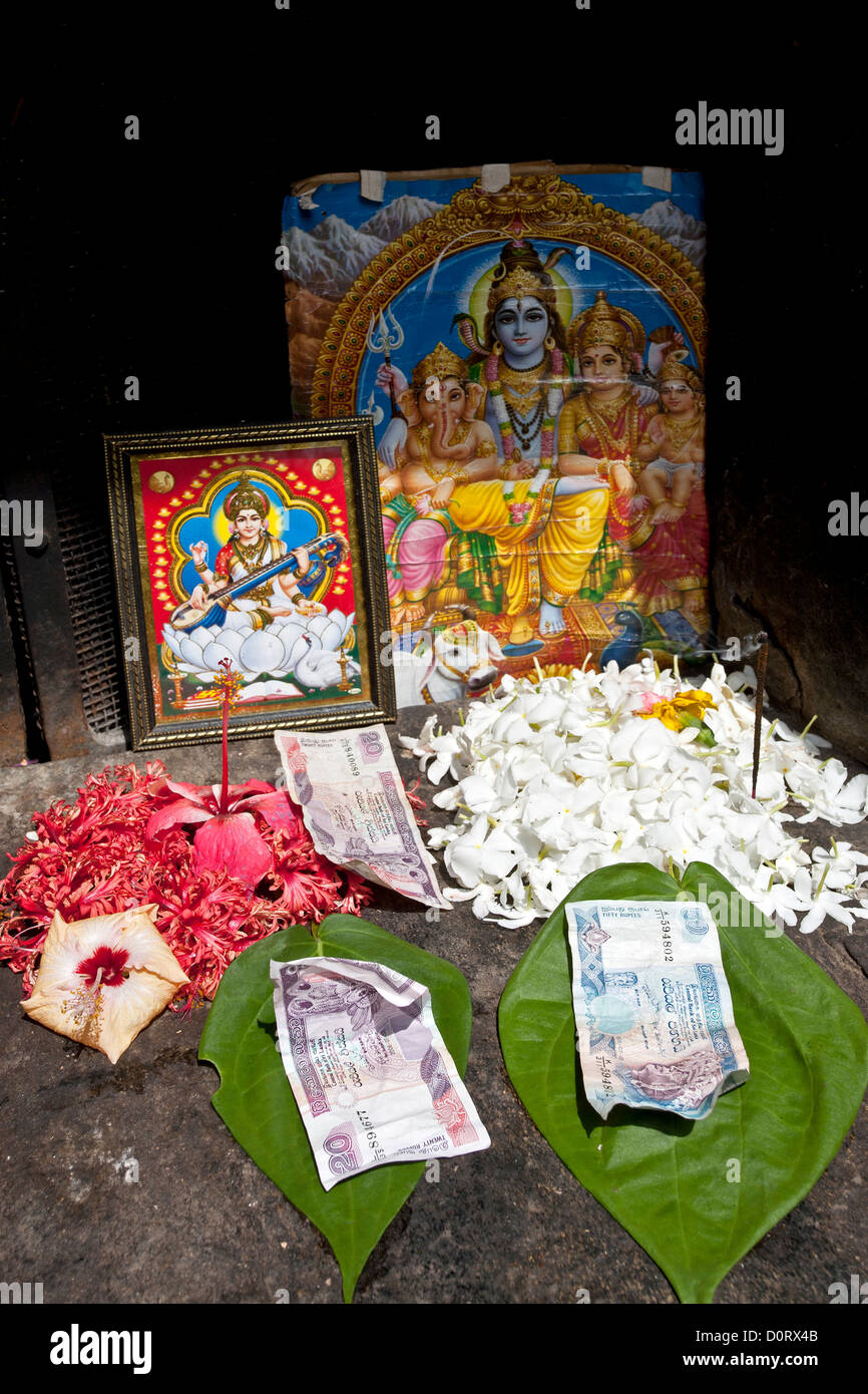 Money and flower offerings. Hindu shrine. Polonnaruwa. Sri Lanka Stock ...
