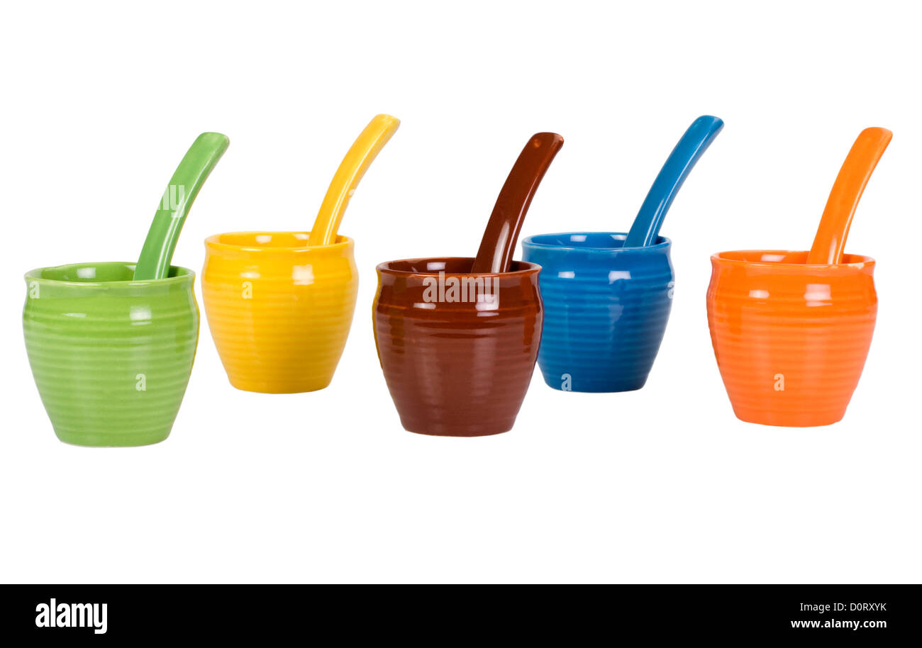 Assorted ceramic containers and soup spoons Stock Photo - Alamy