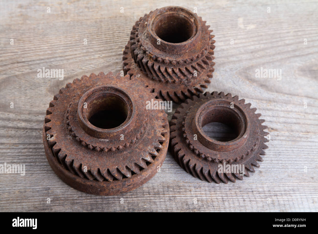 Rusty iron gear wheels on a boards Stock Photo - Alamy