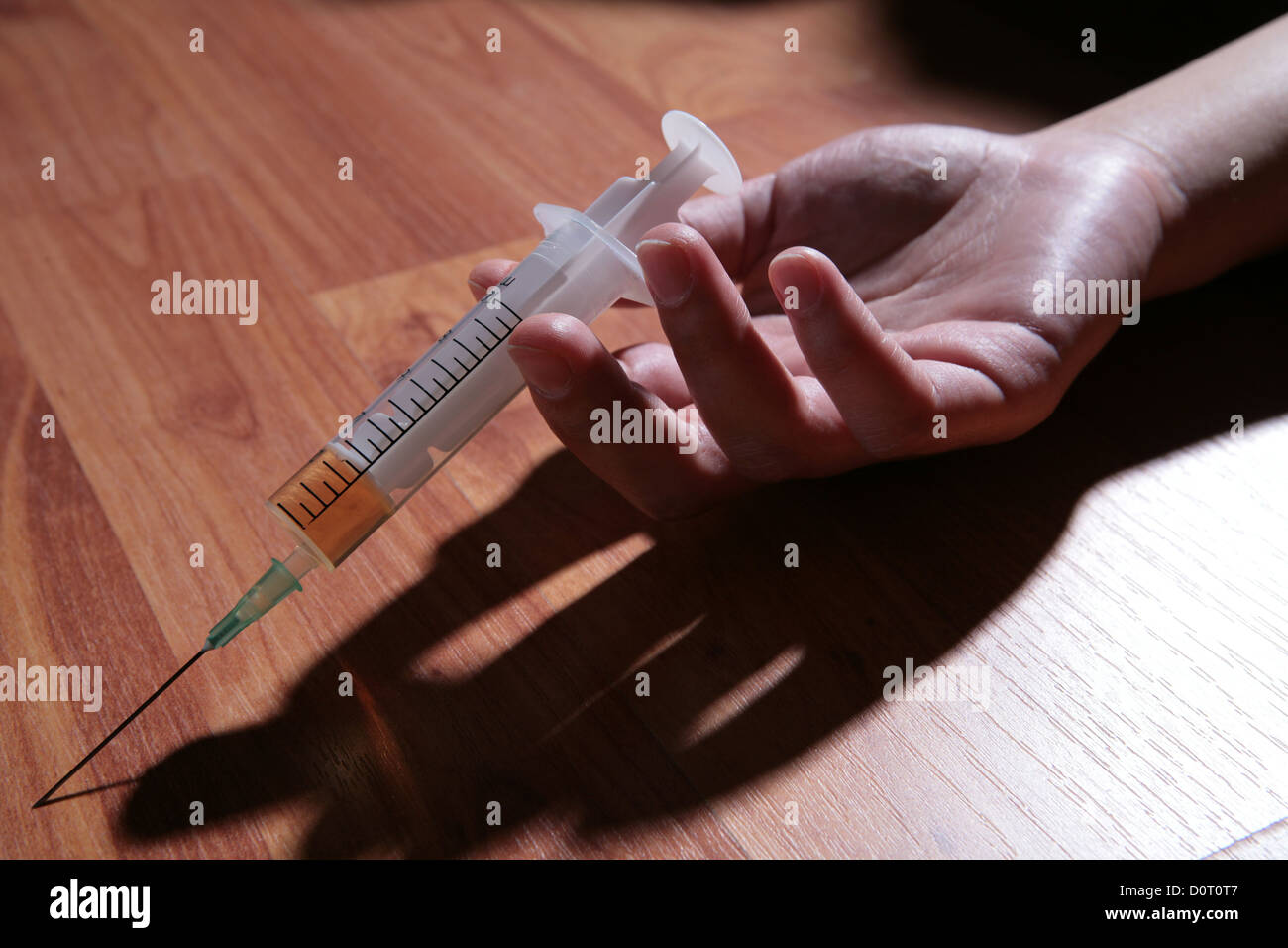 hand and syringe Stock Photo - Alamy