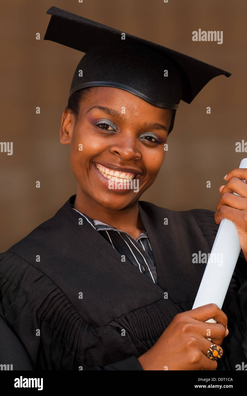 African American College Student Graduating with mortarboard and degree ...