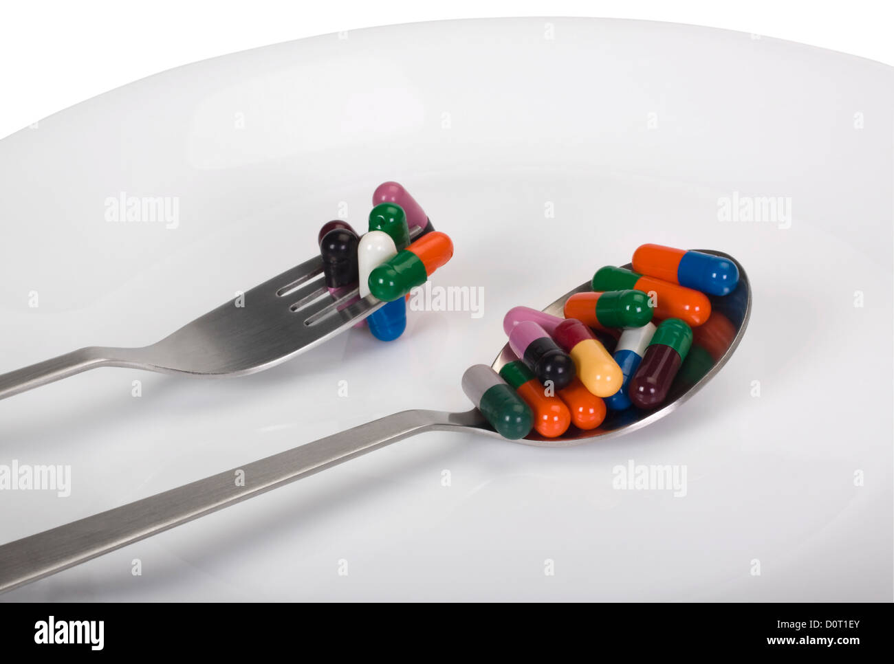 Assorted capsules in a plate Stock Photo - Alamy