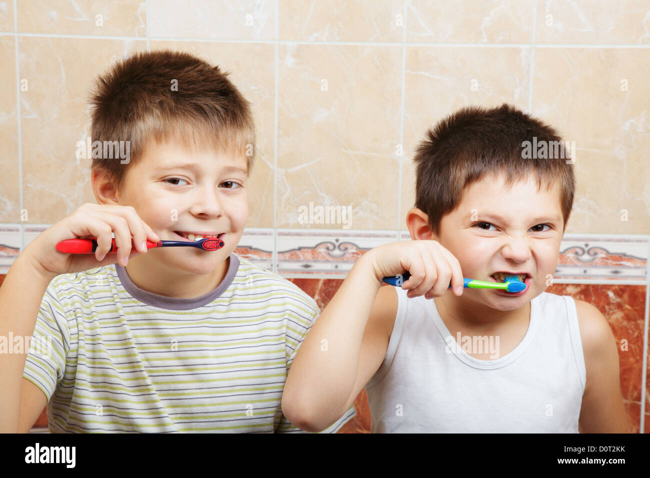 Boys brushing teeth Stock Photo - Alamy