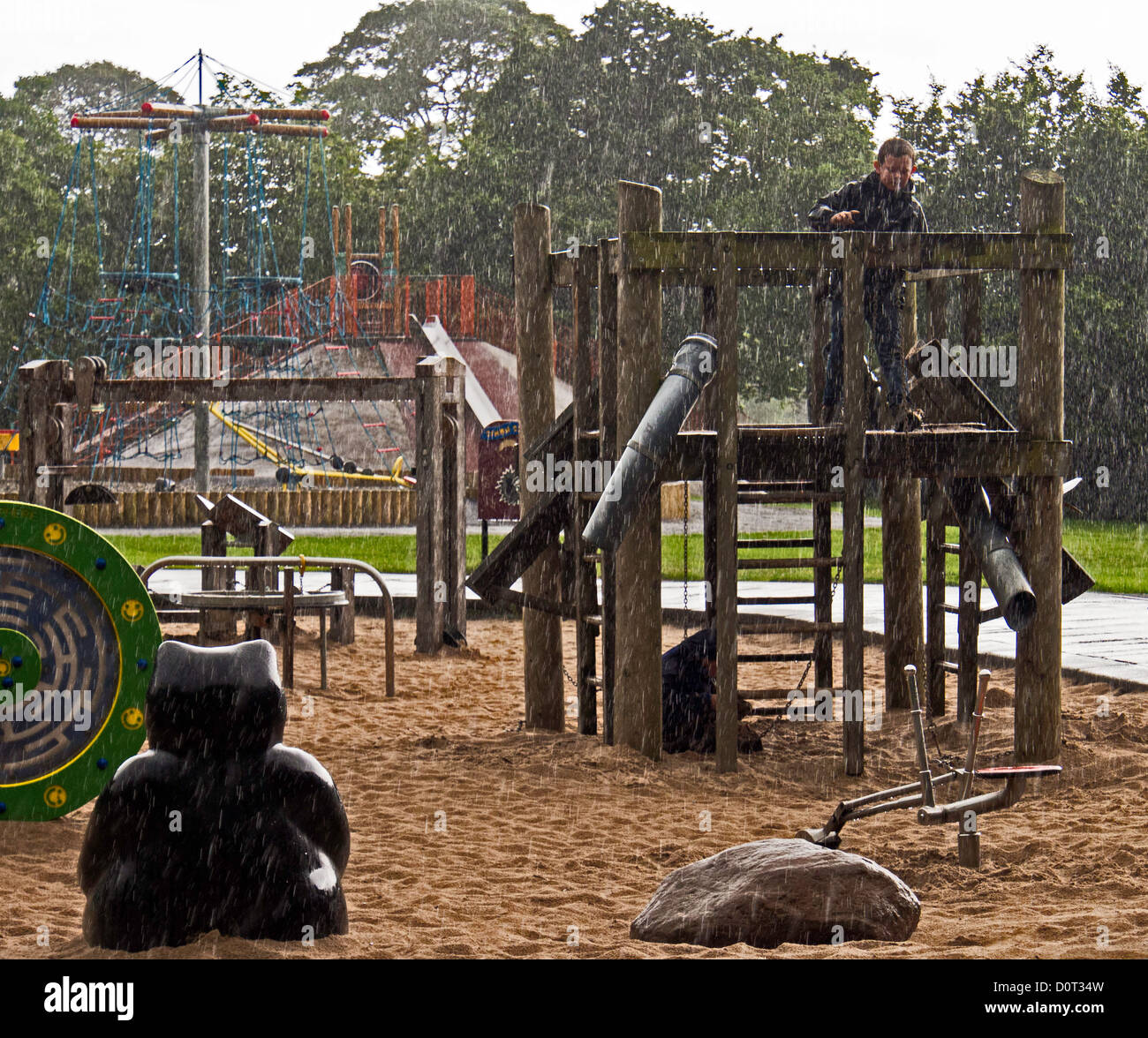 Children playing in the rain hi-res stock photography and images - Alamy