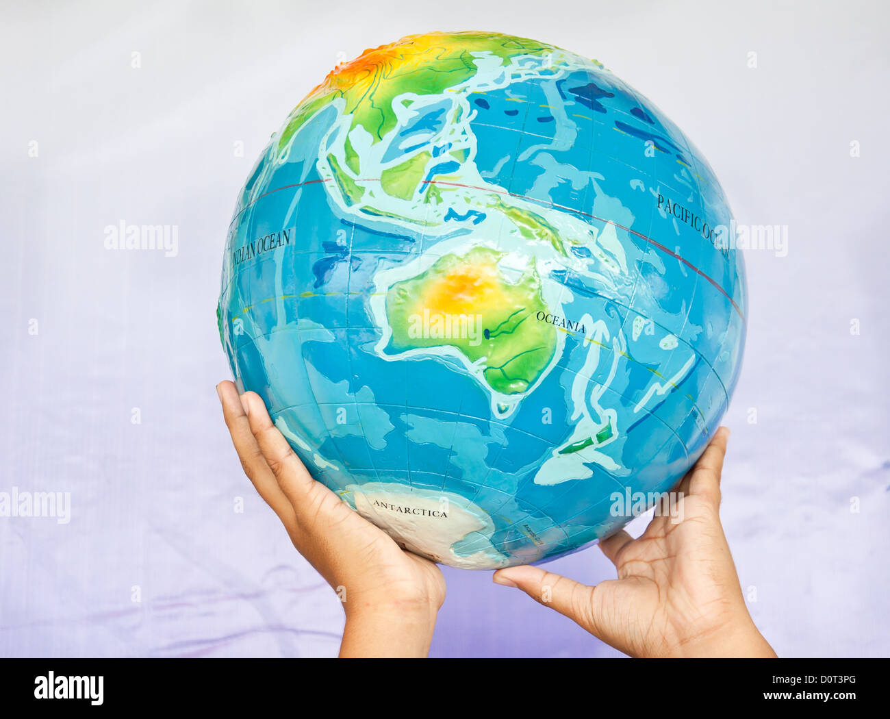 earth on children hand Stock Photo - Alamy