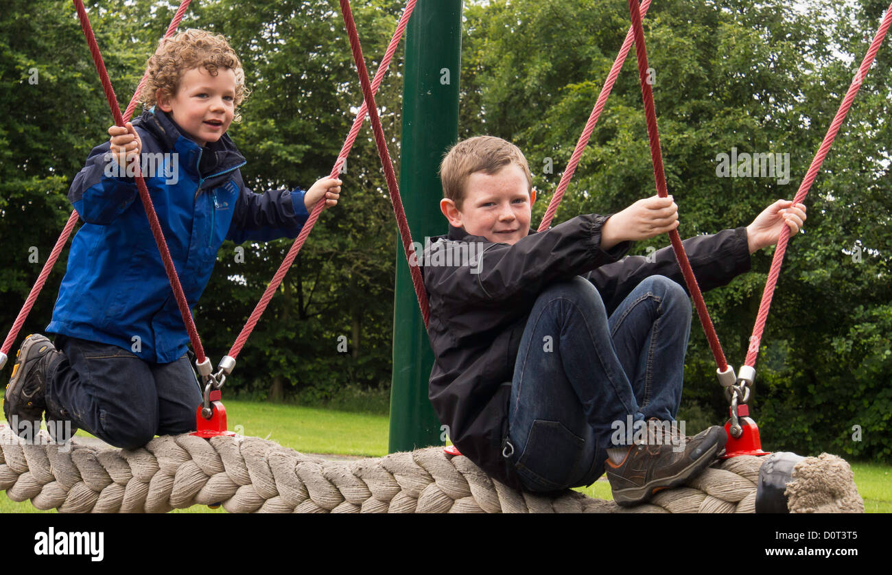 Two brothers playing on playground equipment at Worden Park, Leyland ...