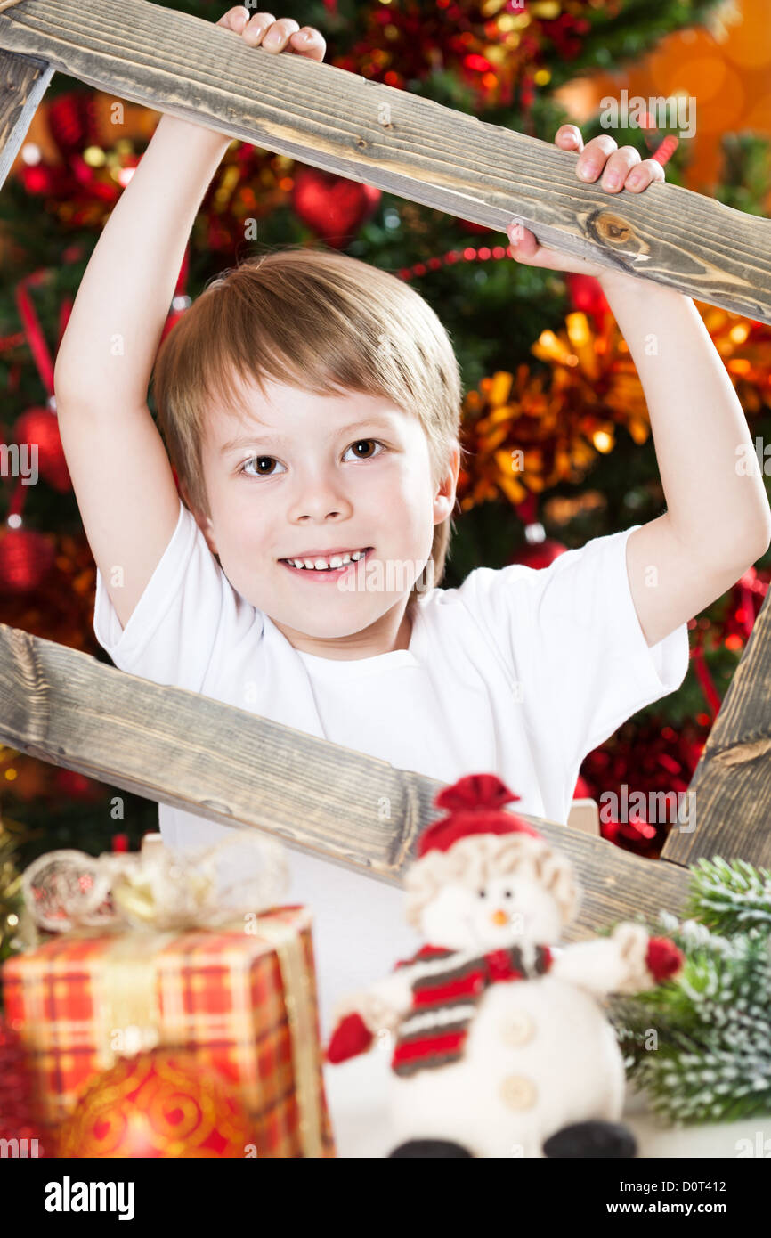 Boy holding old wooden frame Stock Photo - Alamy