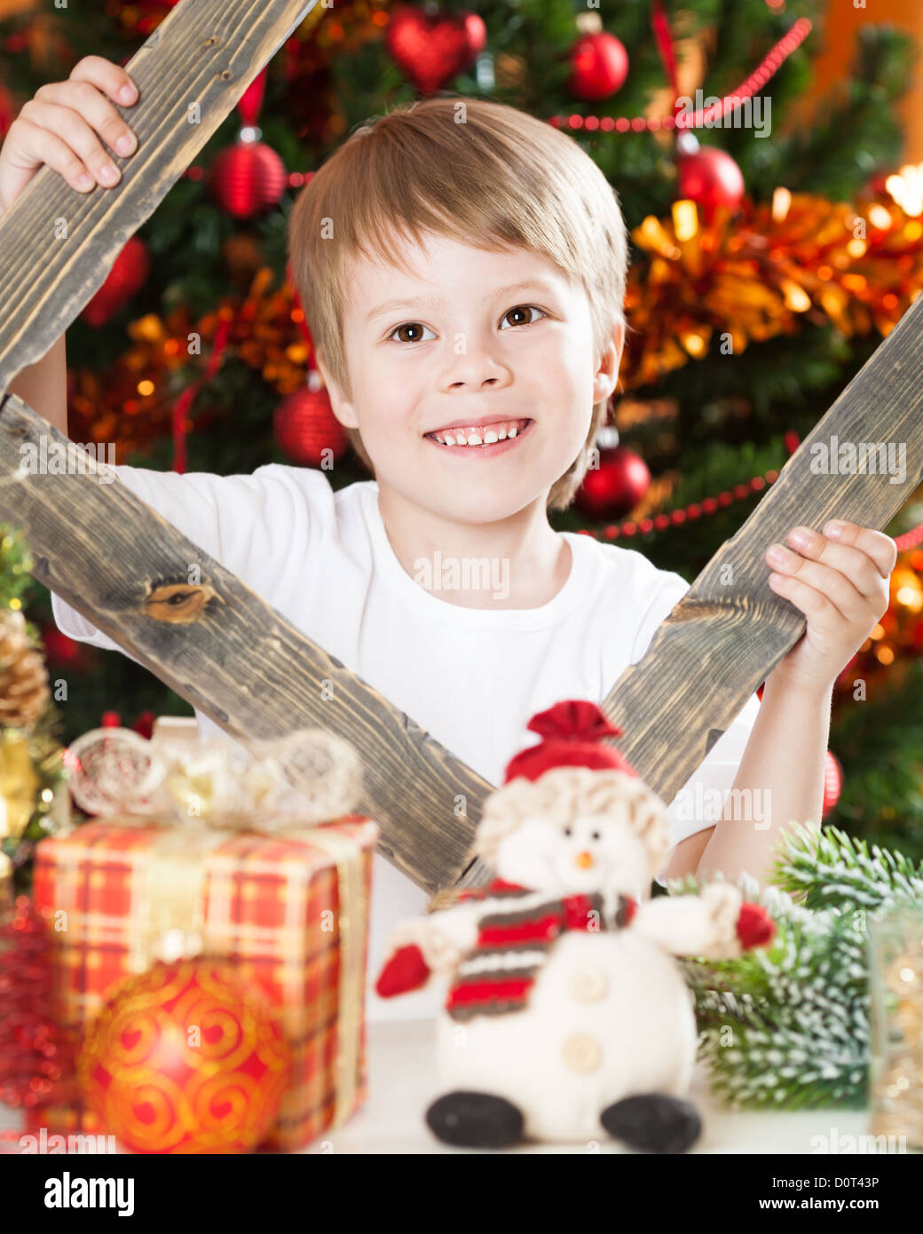Happy boy playing in Christmas Stock Photo - Alamy