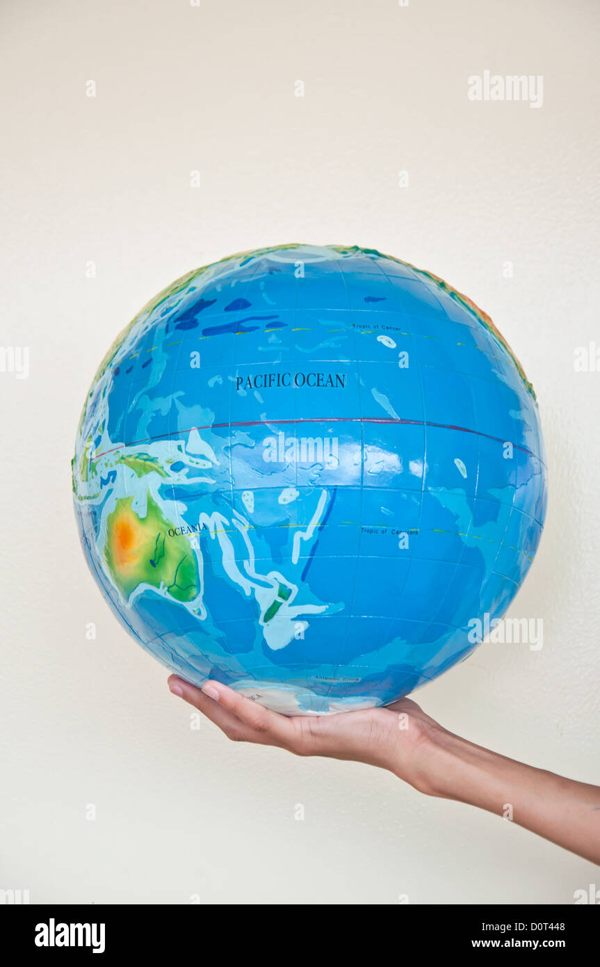 Planet earth children hand hi-res stock photography and images - Alamy