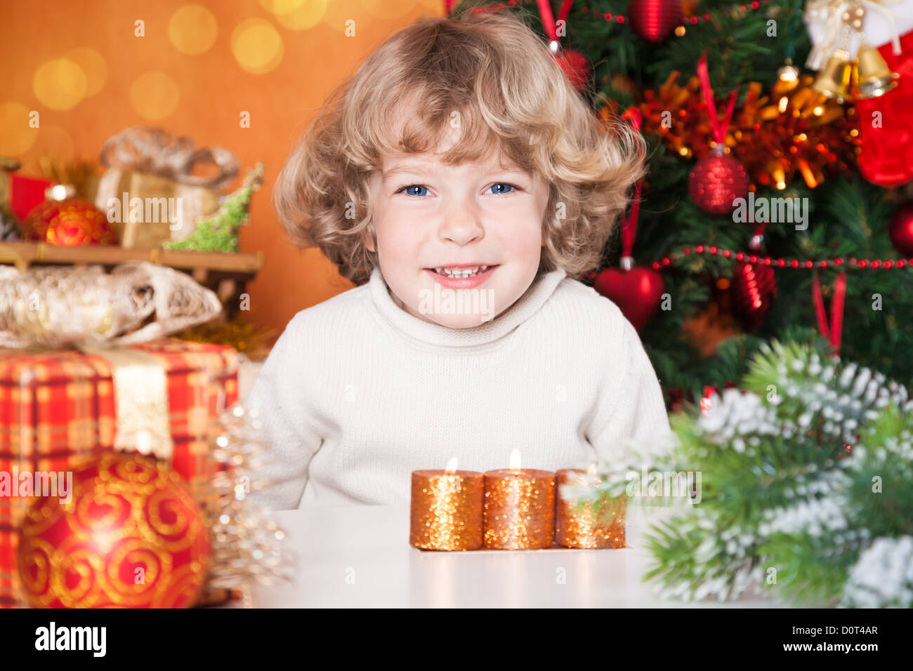 Boy holding candle christmas hi-res stock photography and images - Alamy