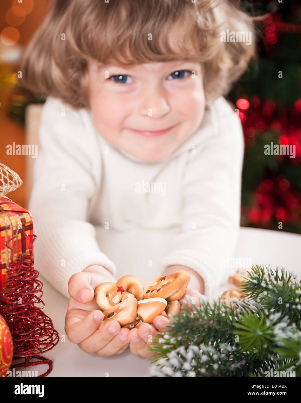 Funny child holding cookies Stock Photo - Alamy