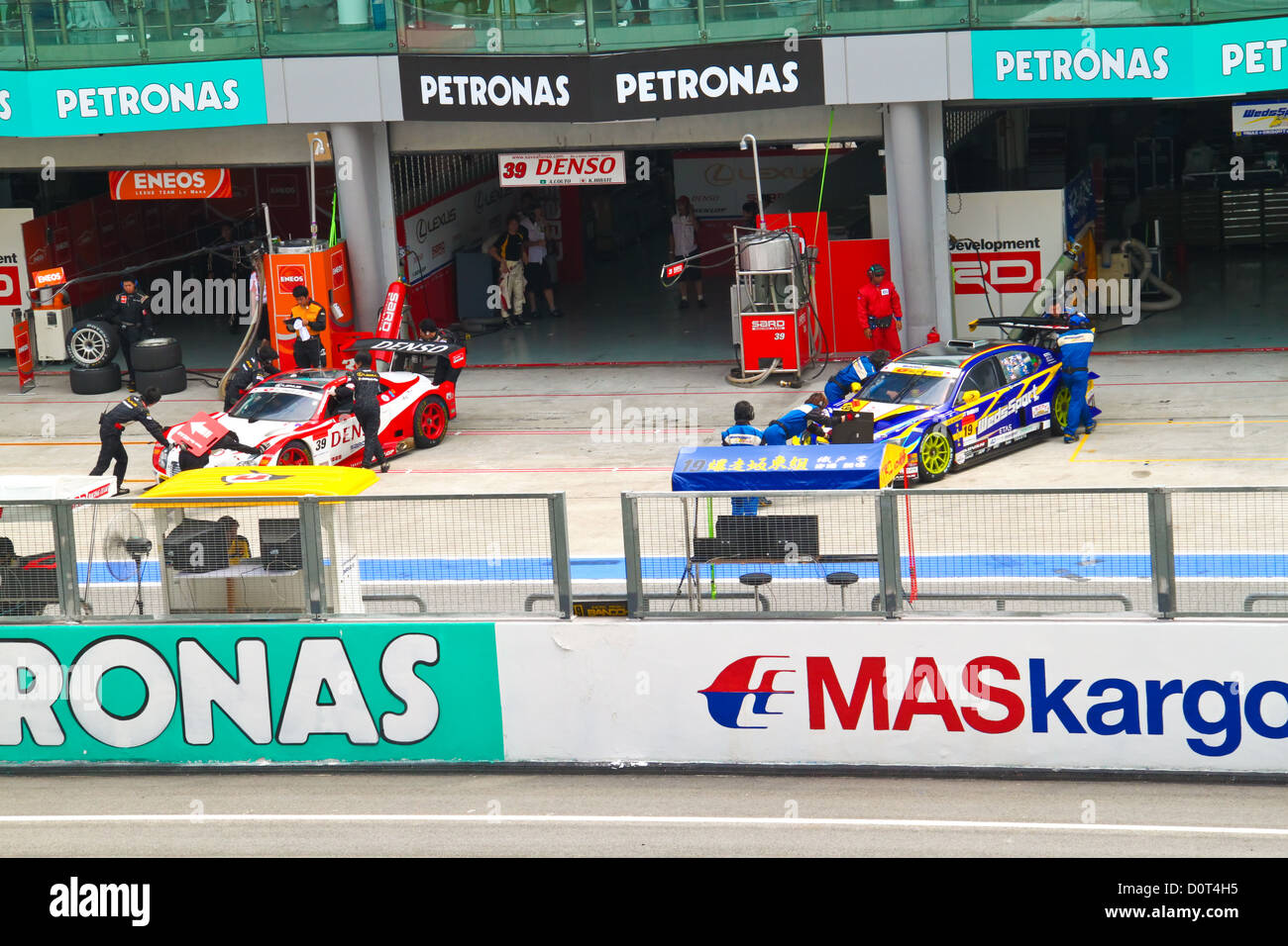 Bandoh Lexus and SARD lexus teams pushing their racing car into the ...