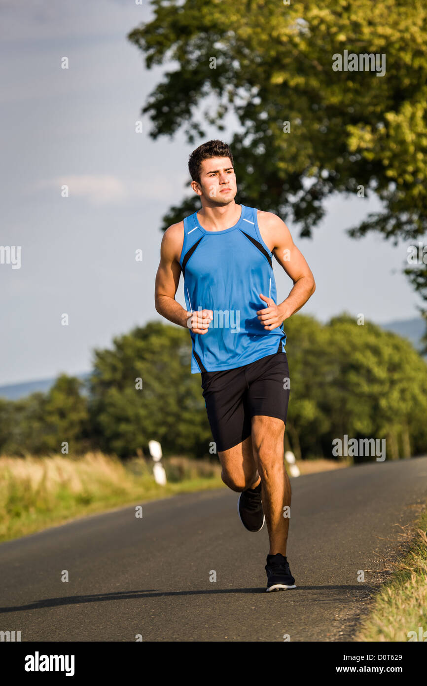 man jogging through the fields Stock Photo - Alamy