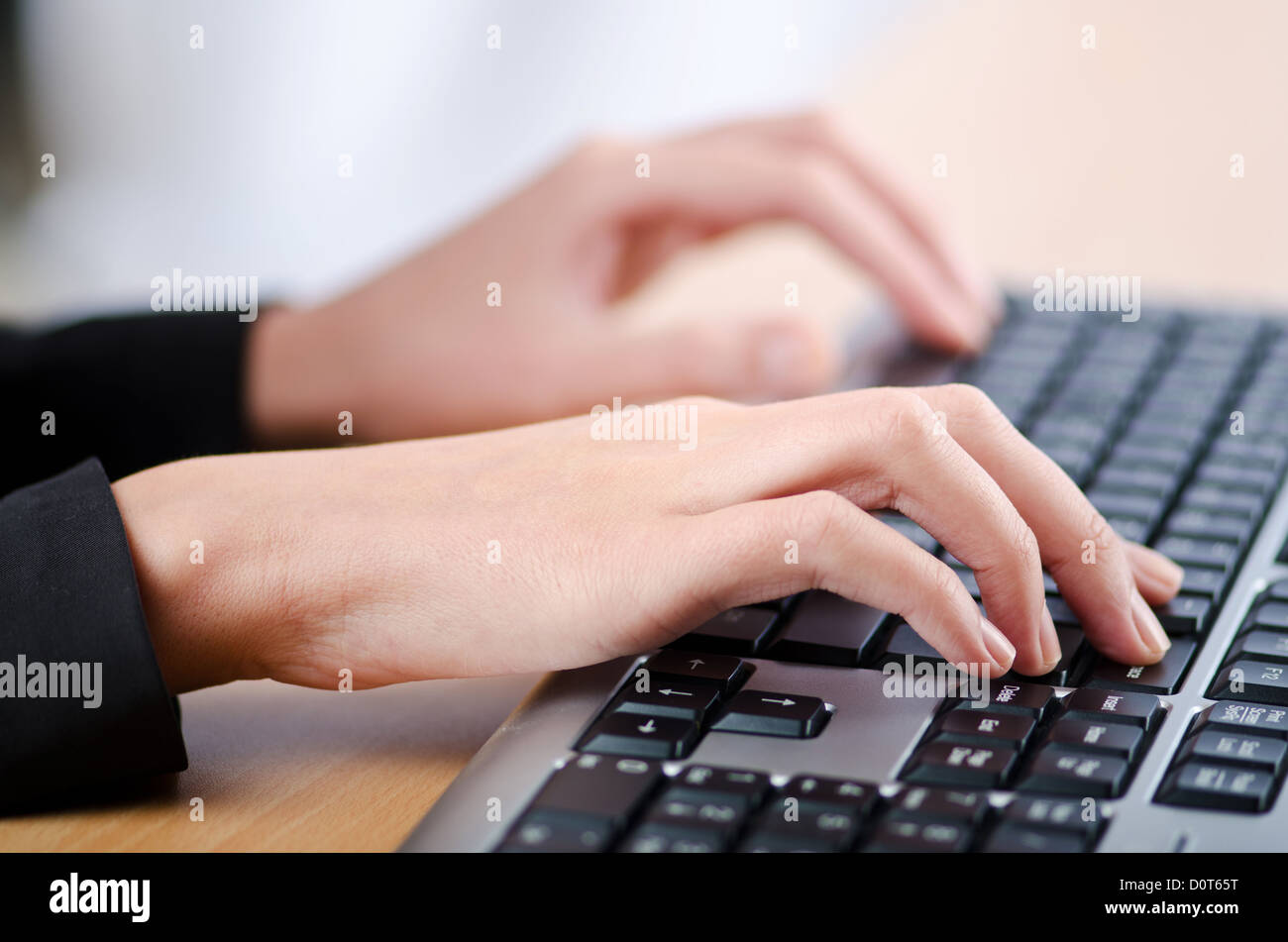 Hands typing on the keyboard Stock Photo - Alamy