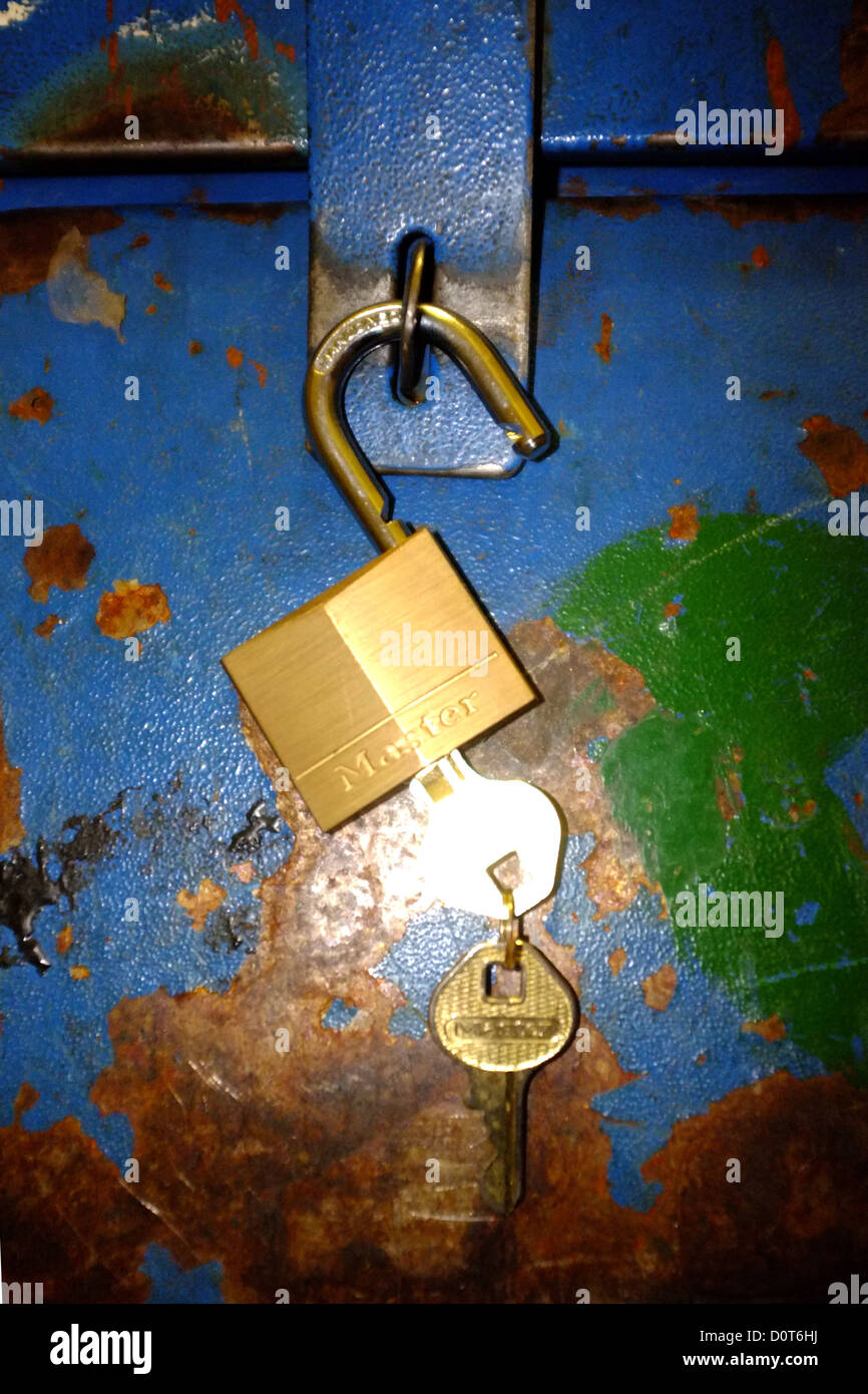An open padlock on the side of a colourful toolbox Stock Photo - Alamy