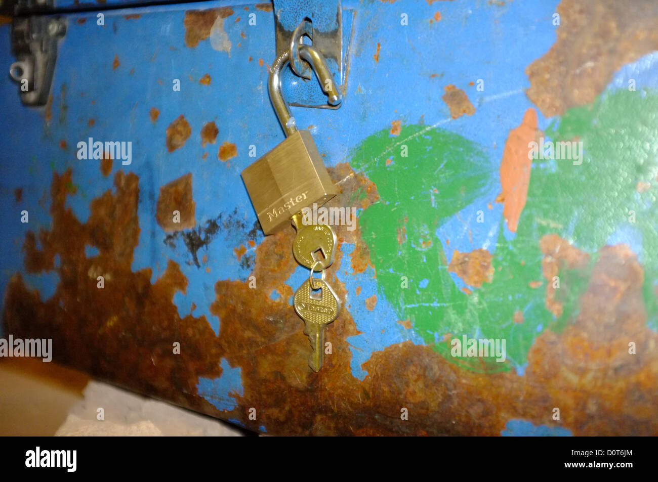 An open padlock on the side of a colourful toolbox Stock Photo - Alamy