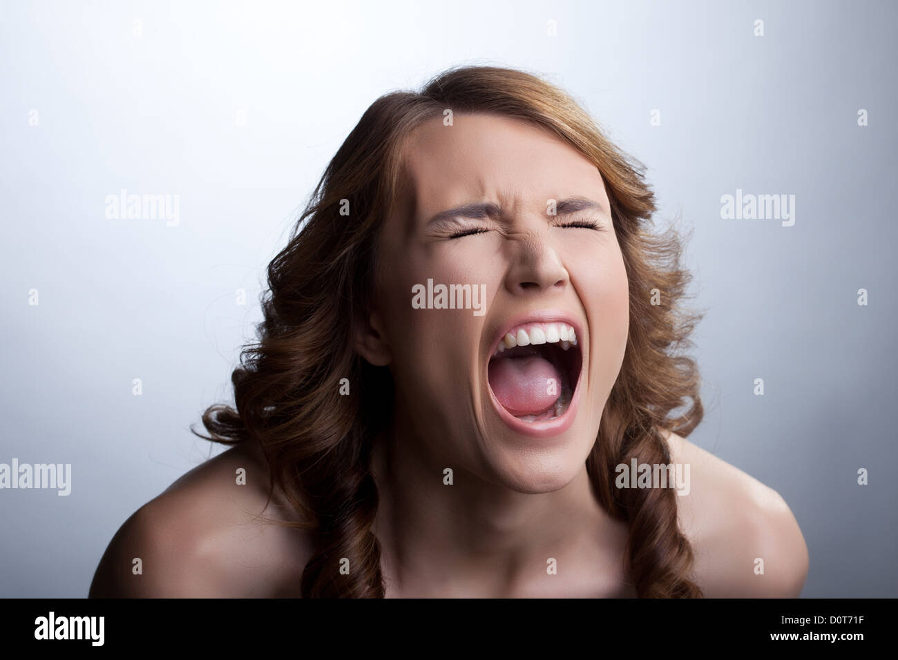 Young woman in stress cry loud Stock Photo - Alamy