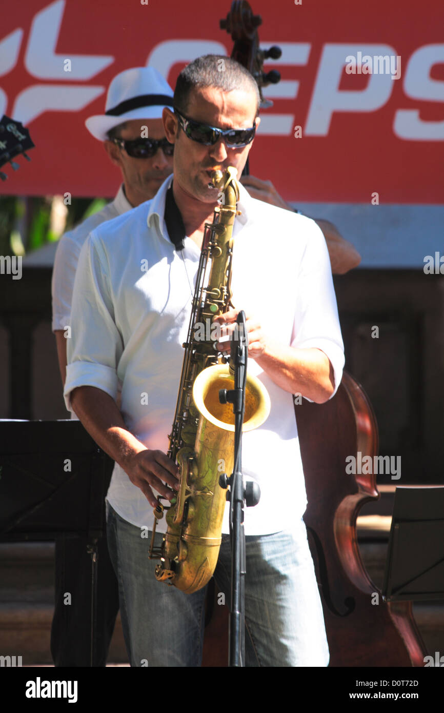 young man playing the saxophone in a live music concert Stock Photo - Alamy