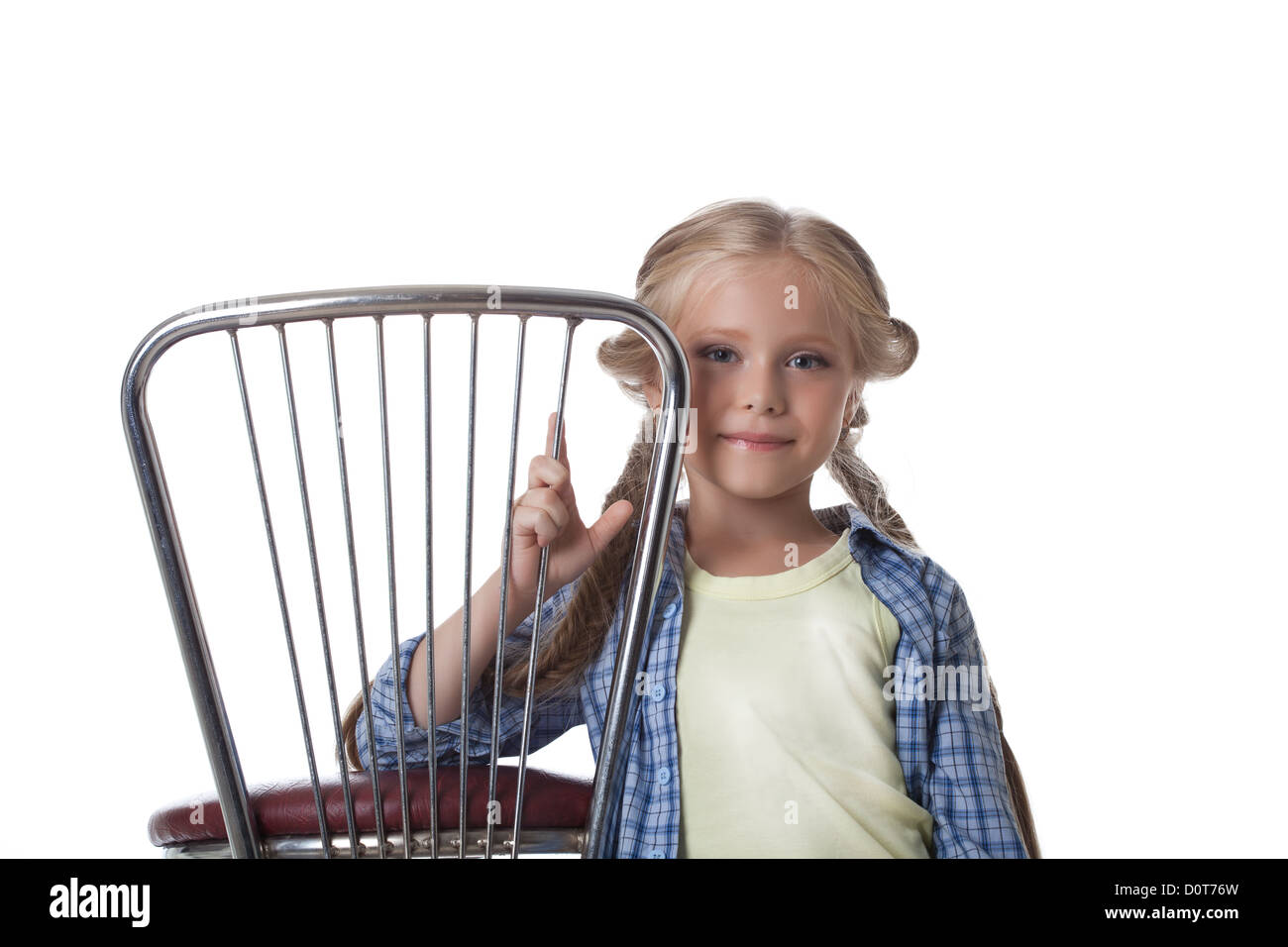 Beautiful blonde girl and chair Stock Photo - Alamy