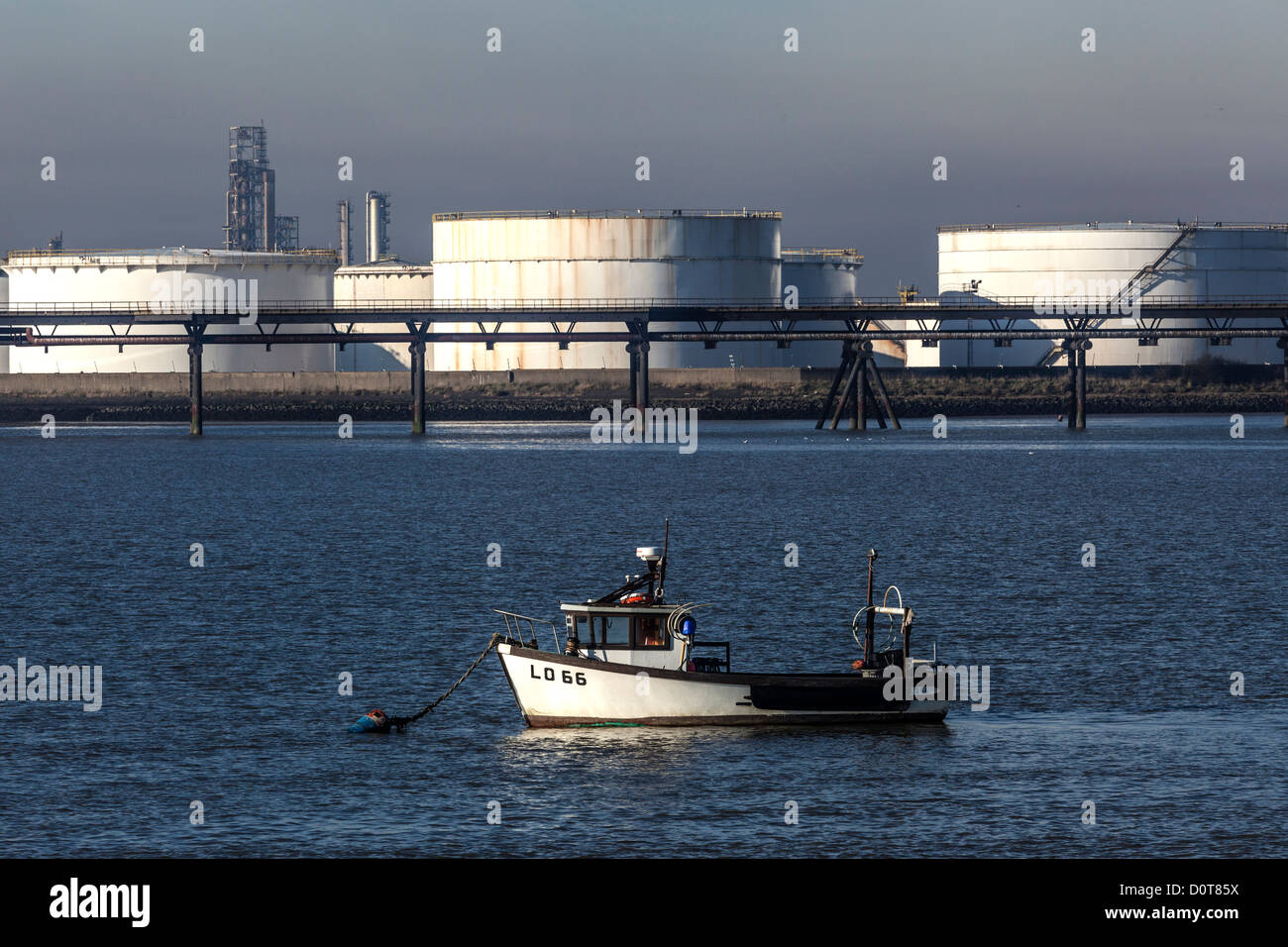 Liquid Storage Tanks at Coryton Refinery with Fishing Boat at Anchor in ...
