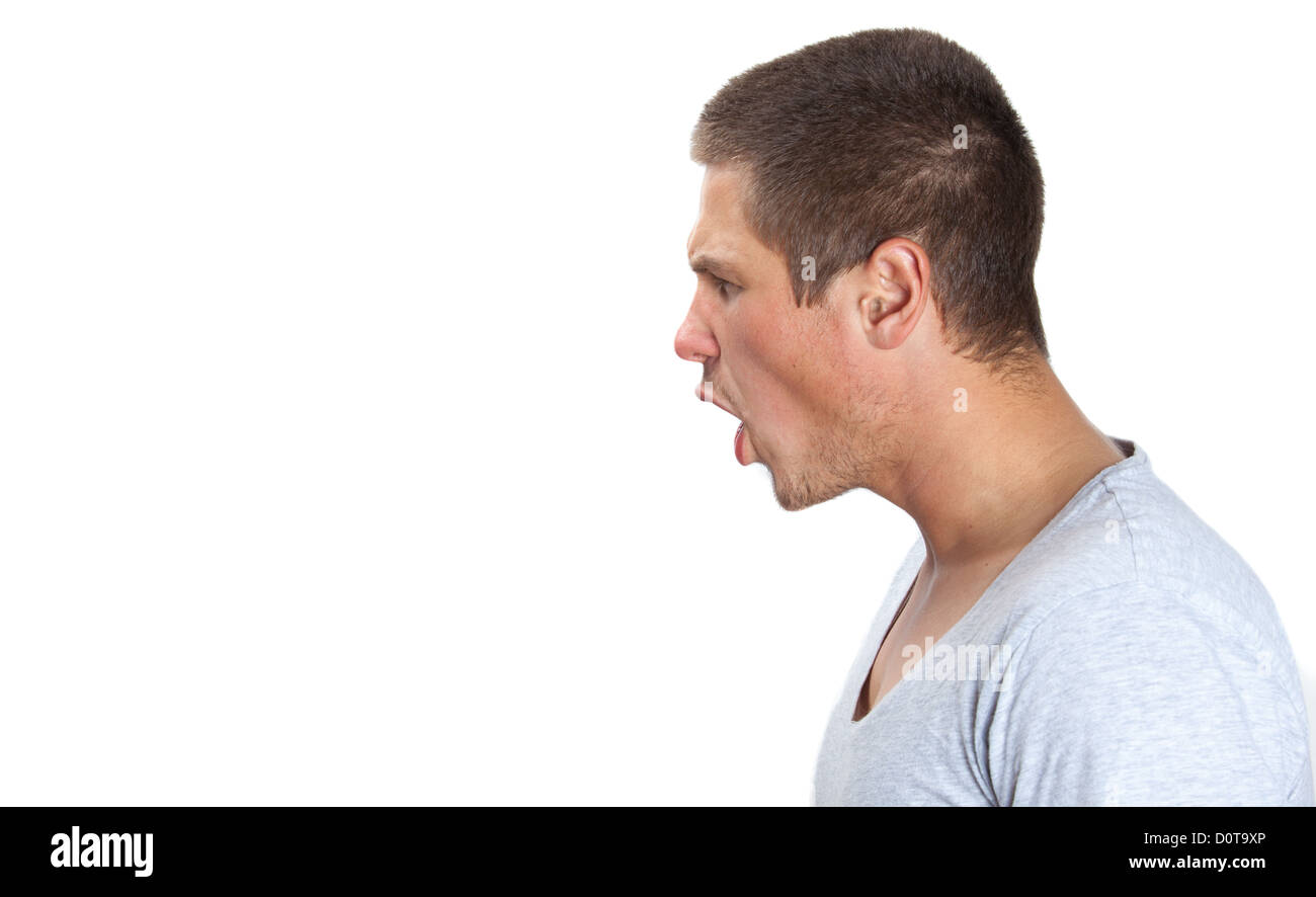 Young man shouting in profile on white isolated background Stock Photo ...