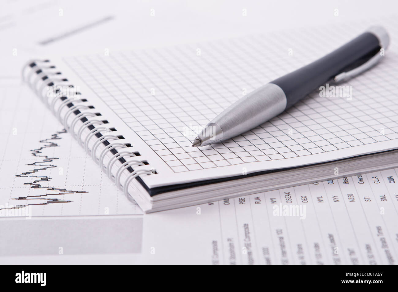 Tables, notebook and exchange data Stock Photo - Alamy