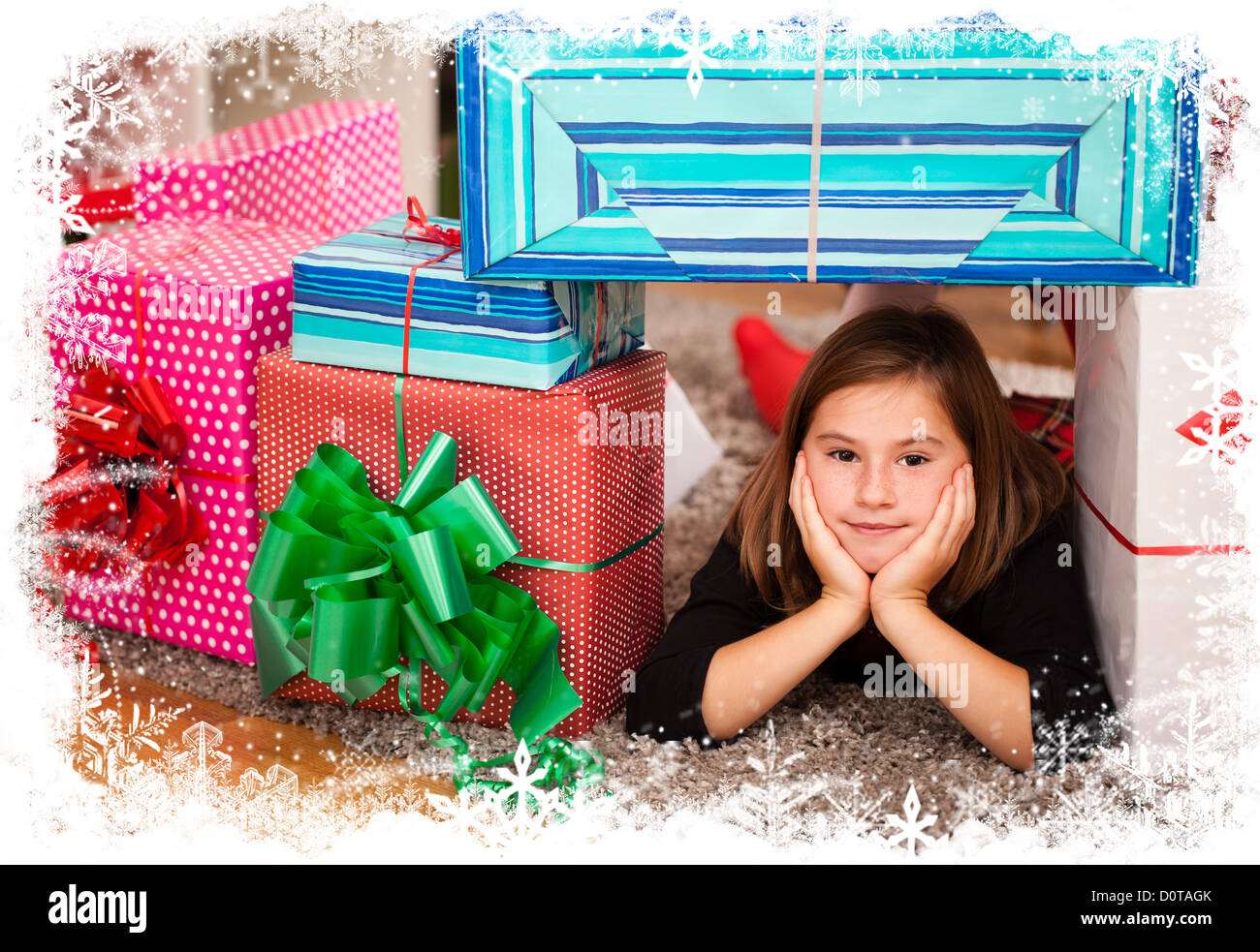 Kids with their christmas presents in snowflake frame Stock Photo - Alamy