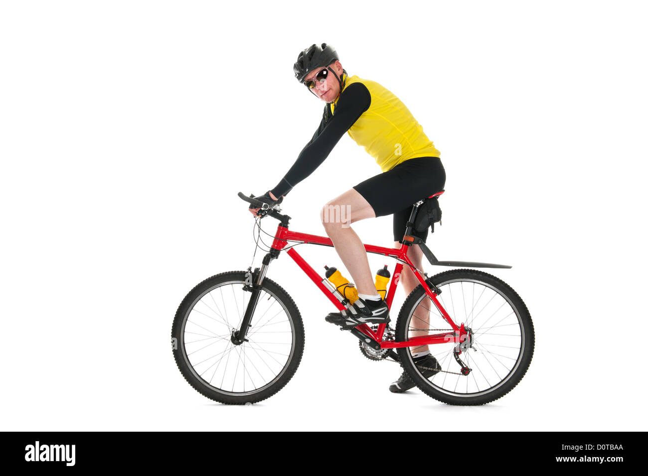 Active mountainbiker rides in studio isolated over white background ...